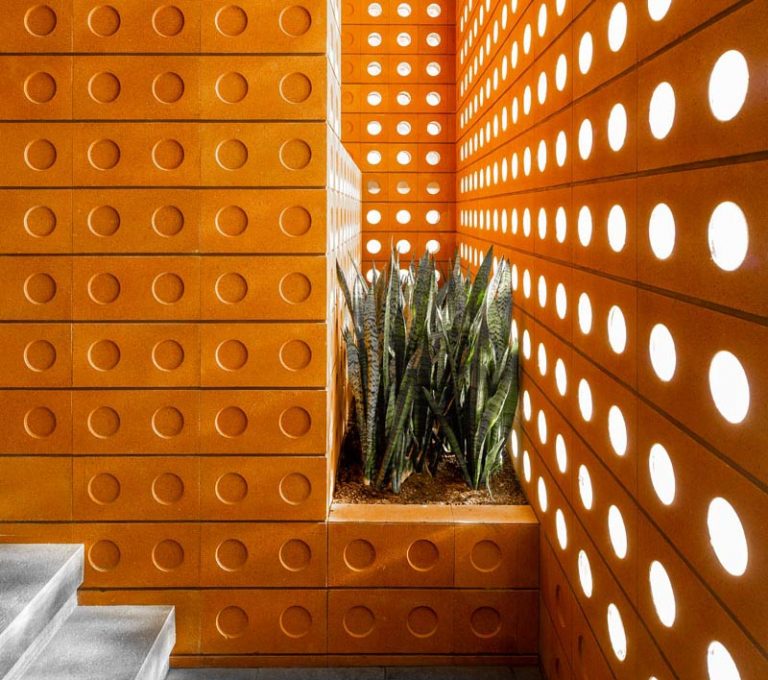 The Brick Walls Alternate Between Circular Patterns And Tiny Windows On ...