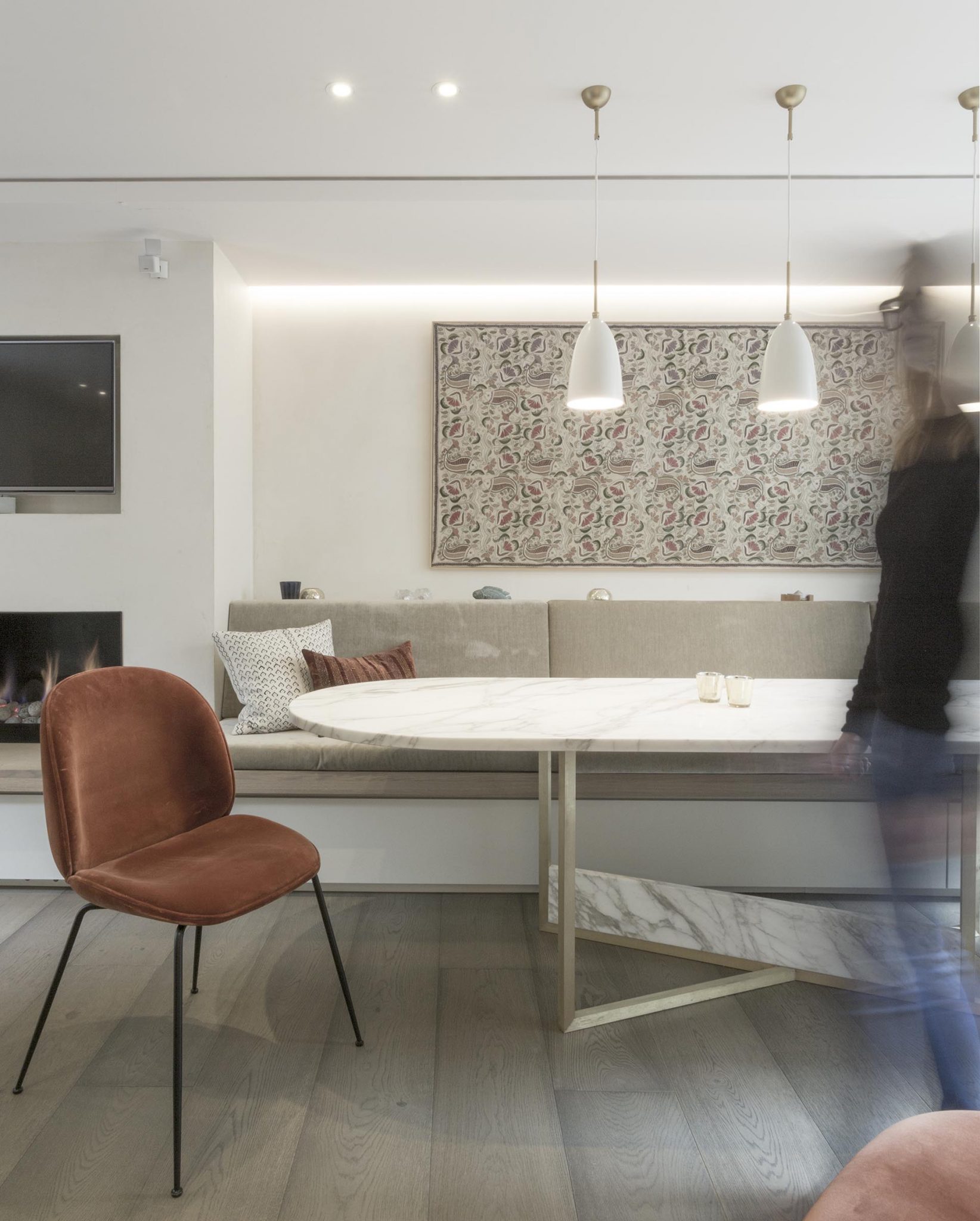 A Built-In Dining Bench Saves Space Inside This Narrow House