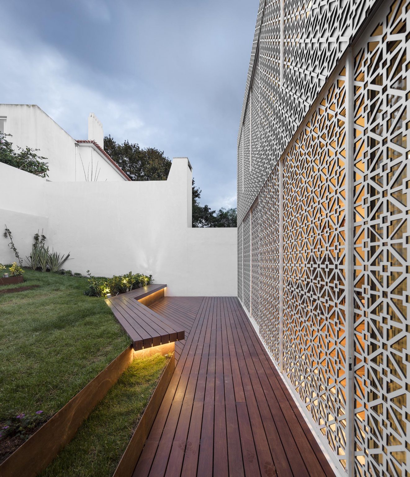 Patterned Security Screens Cover The Windows And Doors On This House In ...