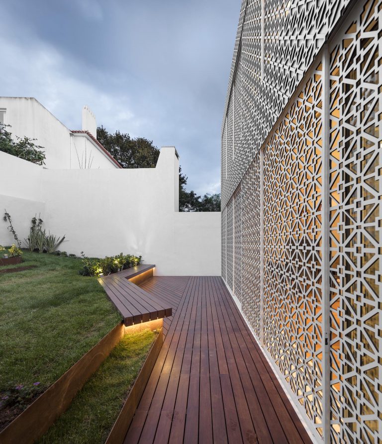 Patterned Security Screens Cover The Windows And Doors On This House In ...