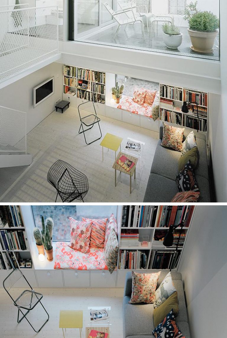 A Cozy Window Seat Surrounded By Bookshelves