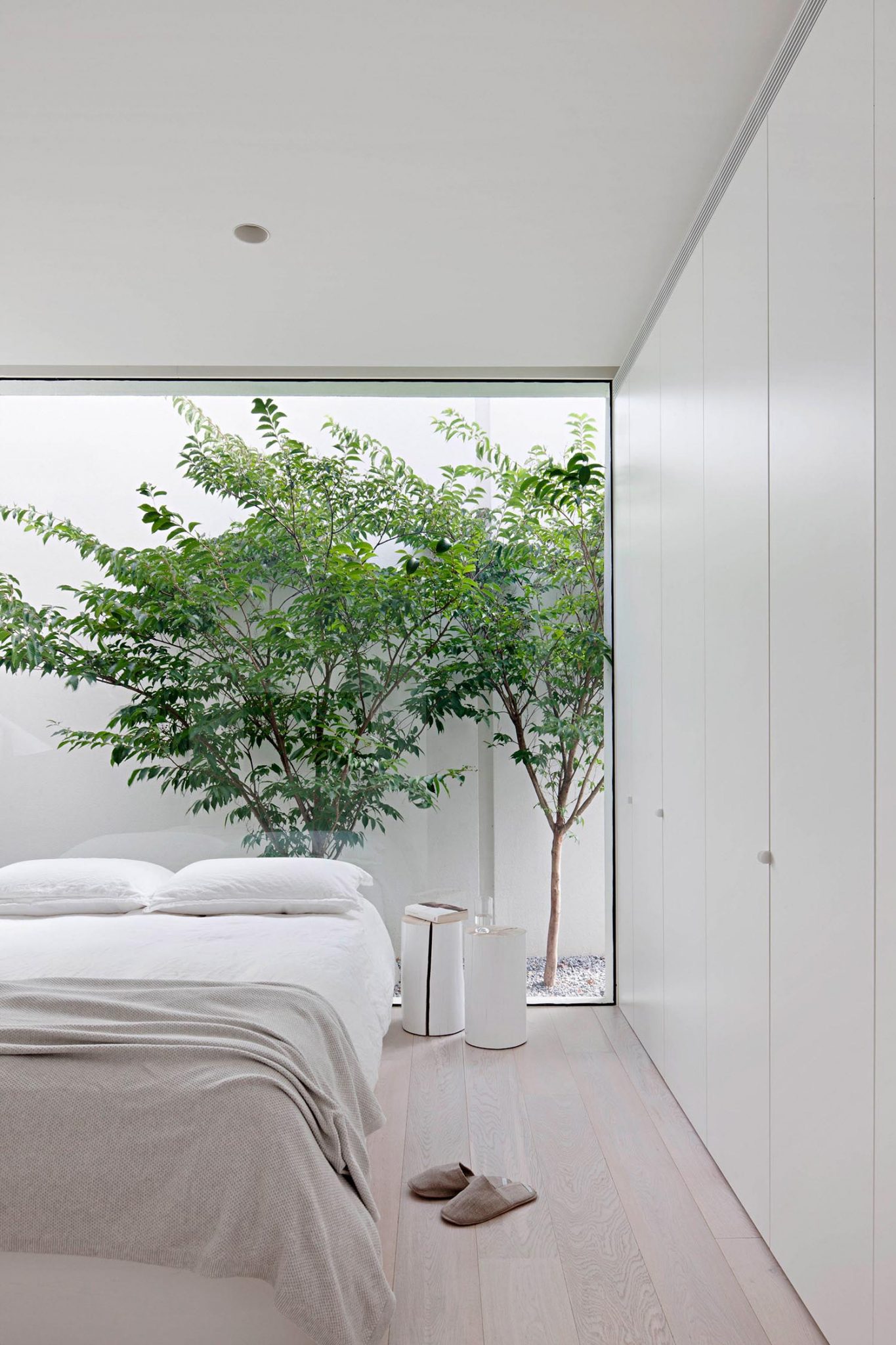 The Minimalist White Exterior Of This Modern House Opens To A Matching ...