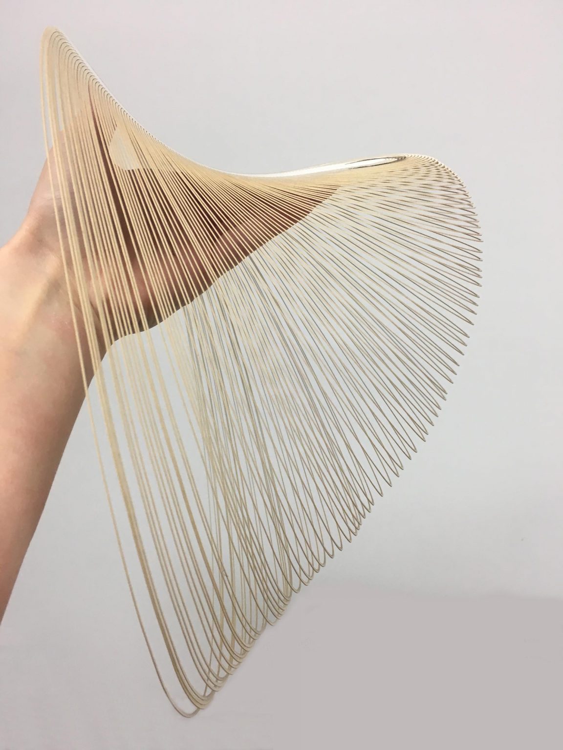 An LED And Laser-Cut Wood Combine To Create This Sculptural Pendant Light