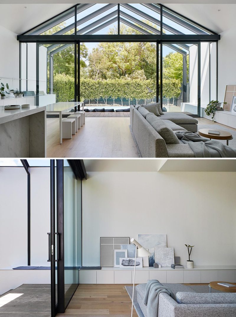 A Wall Of Windows With Sliding Glass Doors Connect The Interior Of This ...