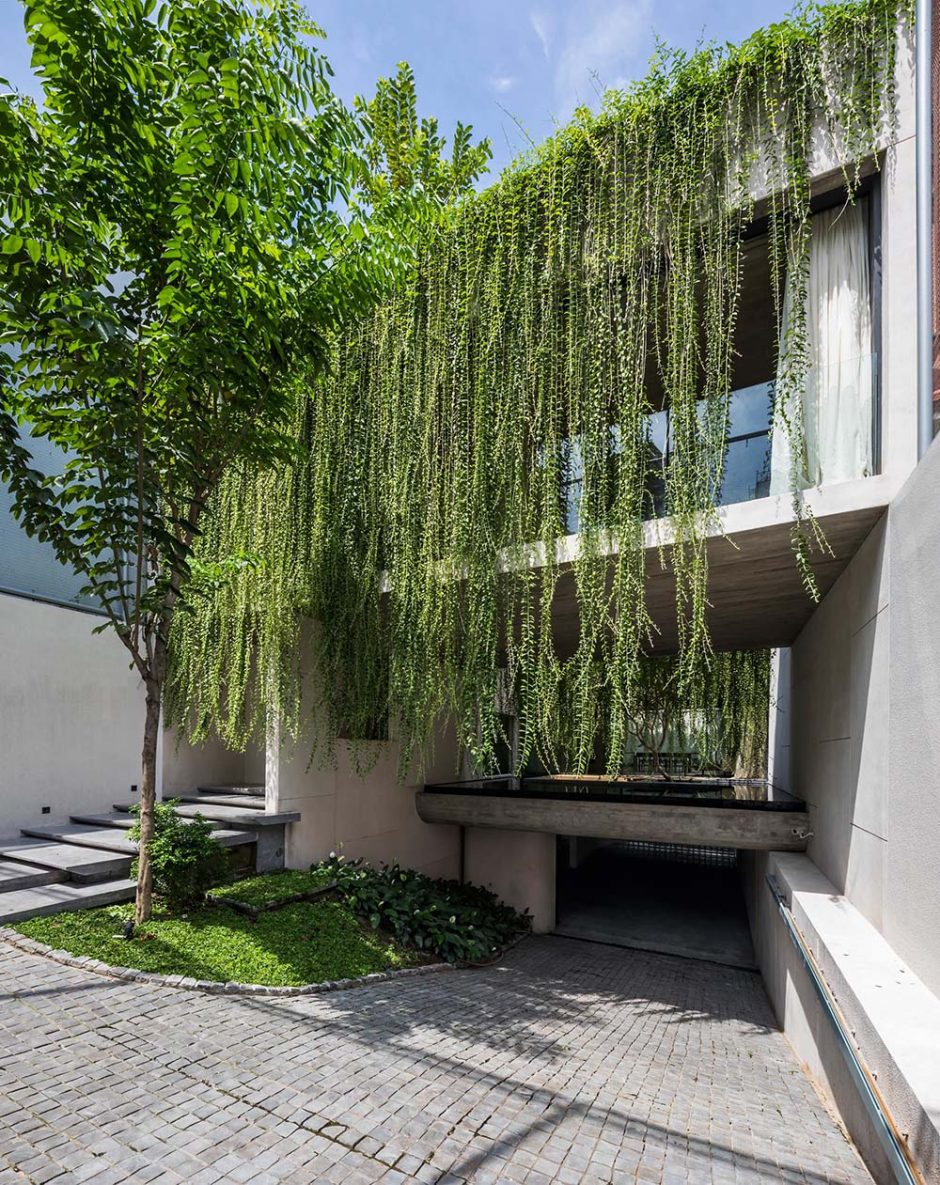 Extensive Hanging Plants Soften The Use Of Concrete In This Homes Design