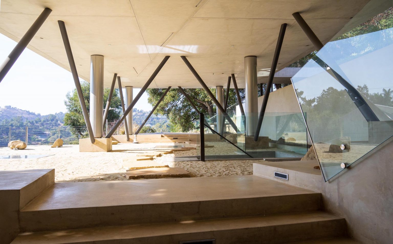 A Spacious Underground Office Was Added To This Concrete Home