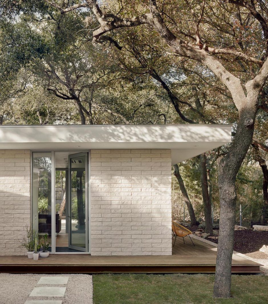 Glass Walls Enclose The Small Guest House In This Home's Backyard