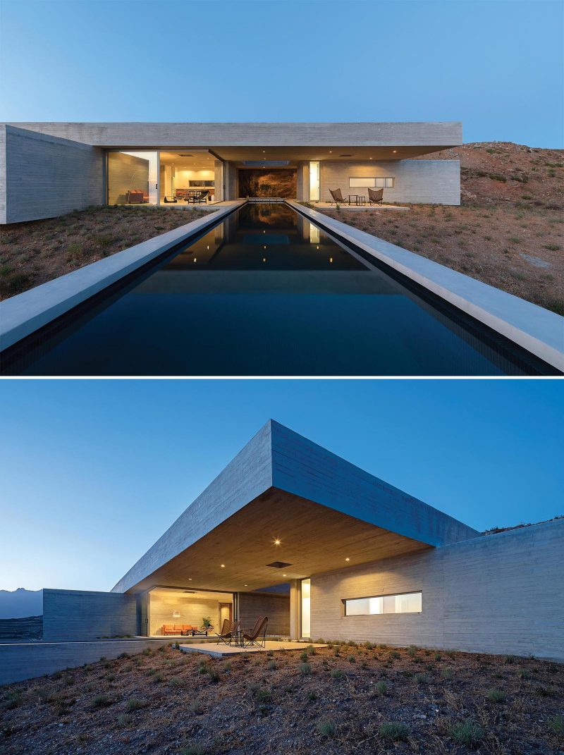 A Long Thin Swimming Pool Extends Out From This Hillside Home