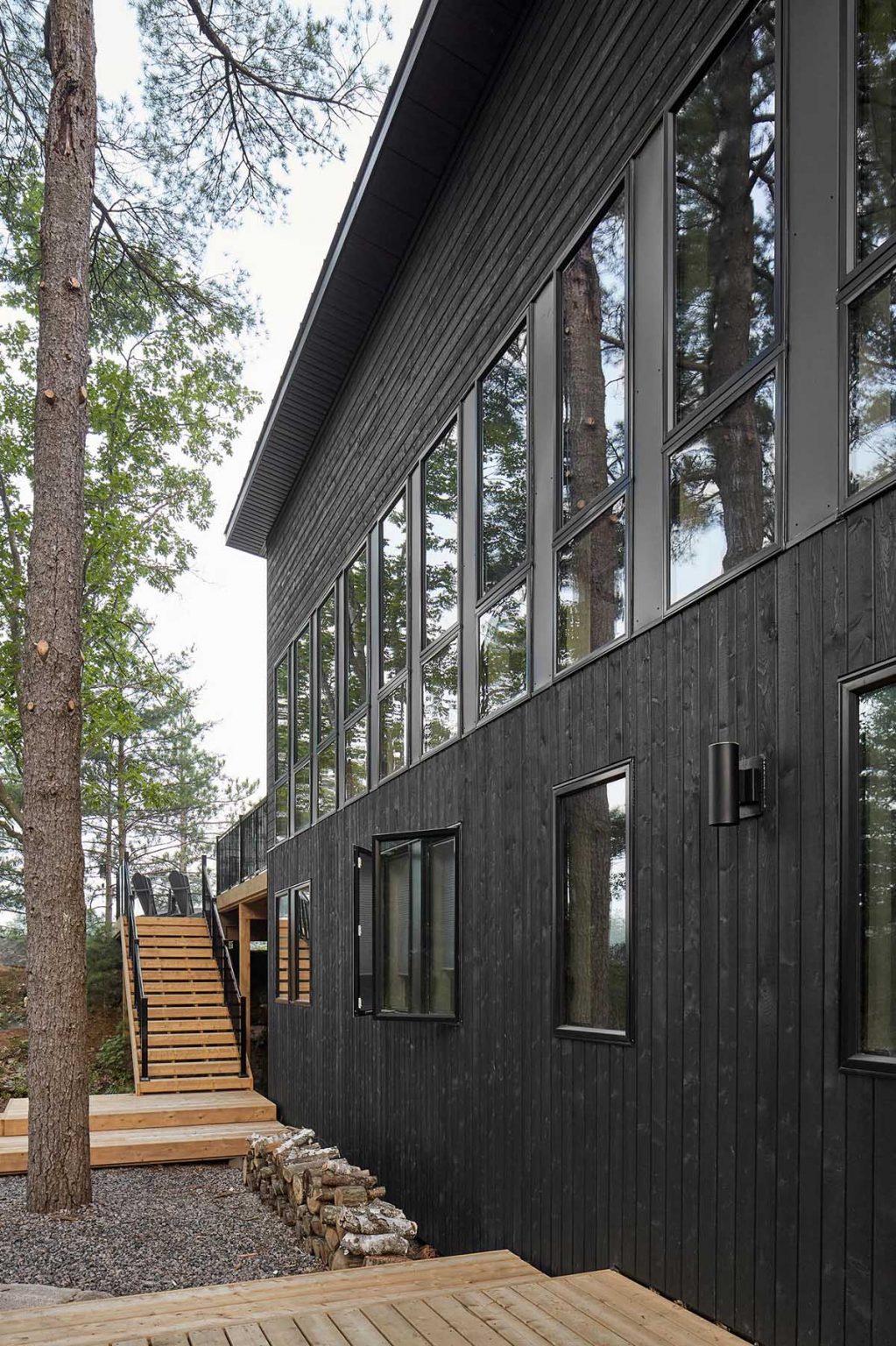 Black Windows Frames Blend Into The Black Wood Siding On The Exterior ...