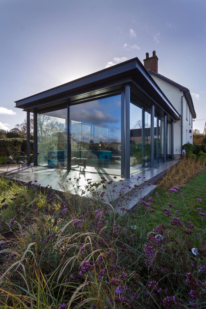 A Glass Enclosed Extension Added More Living Space To This Home