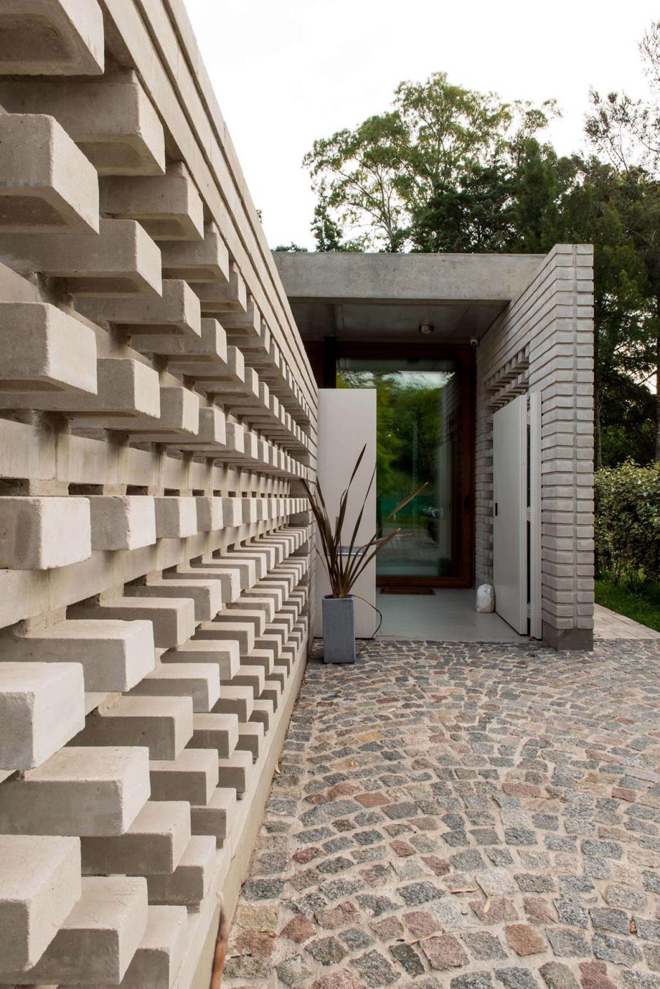 Unique Concrete Walls Act As A Privacy Fence And Allow The Breeze To ...
