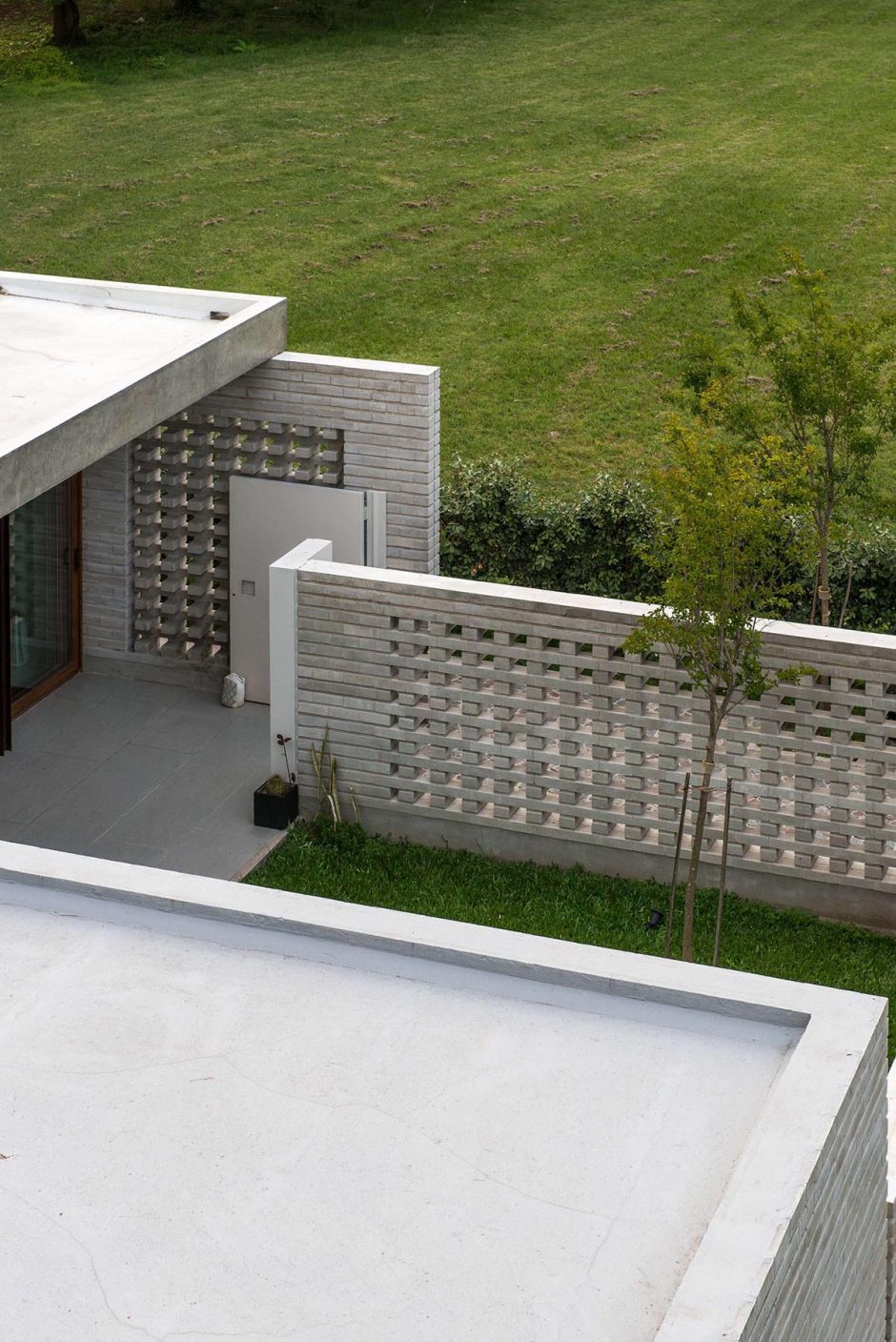 Unique Concrete Walls Act As A Privacy Fence And Allow The Breeze To ...