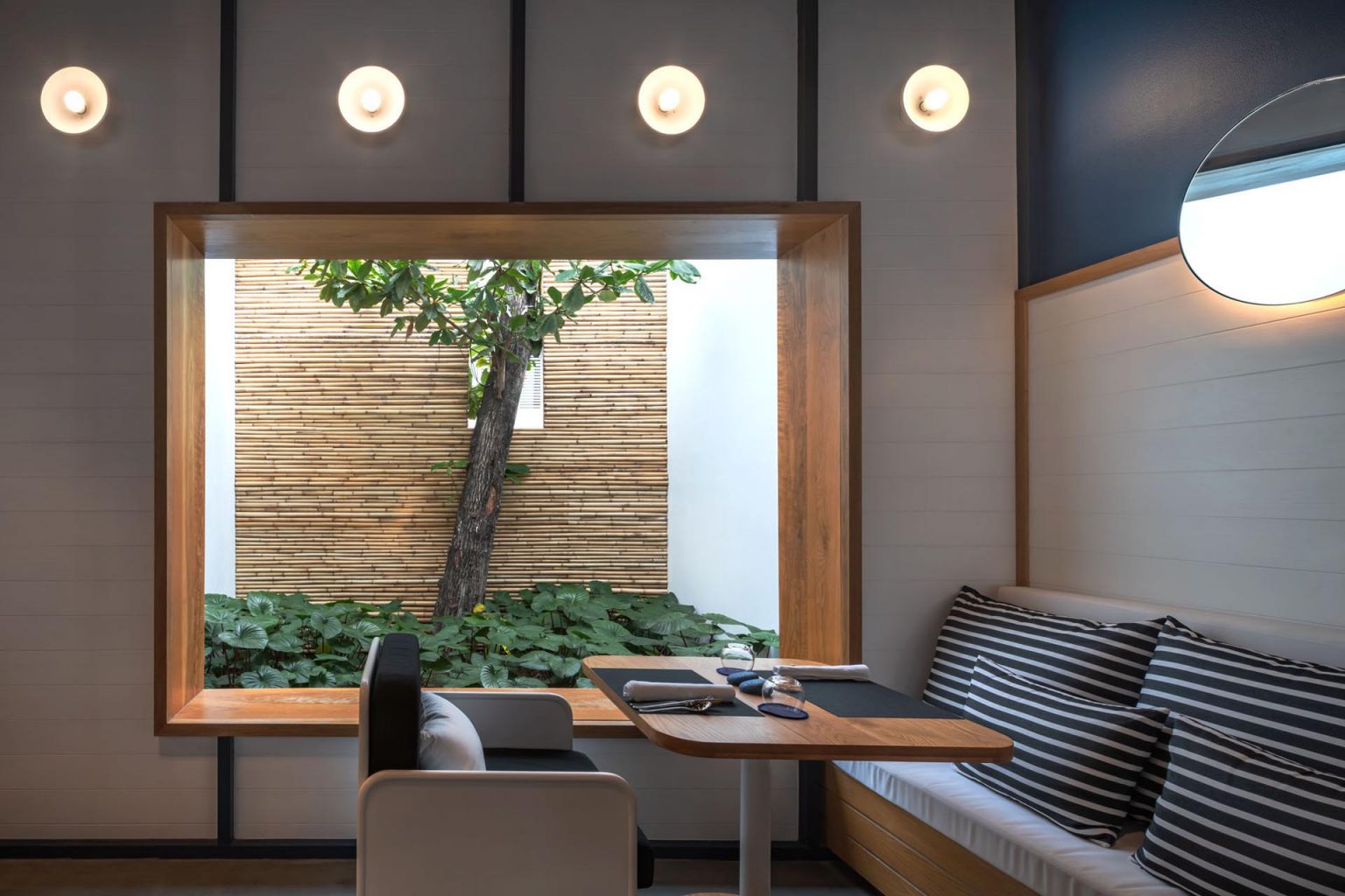 This Landscaped Outdoor Space Includes A Living Room With A Bookshelf ...