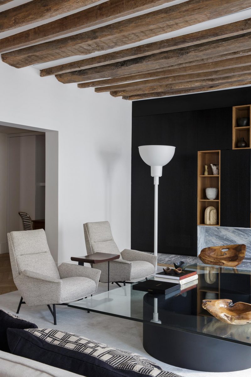 A Matte Black Kitchen Contrasts The Lighter Interior Furnishings Inside ...