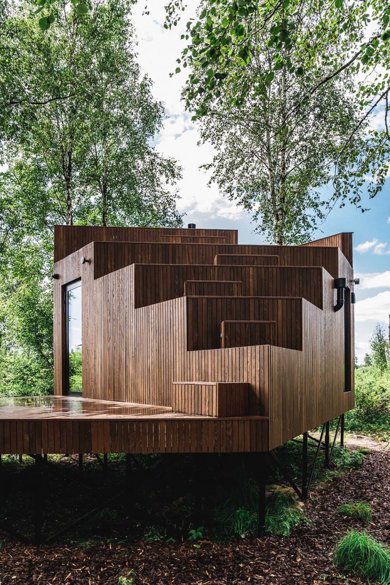 Walls Of Windows On This Cabin Allow For Views Of The Surrounding Forest