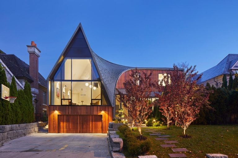 A Curved Roof Covered In Diamond-Shaped Zinc Shingles Adds A Creative ...
