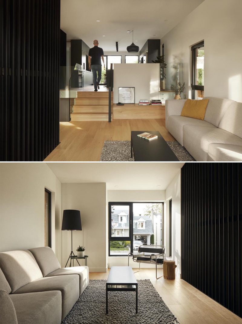 A Black Partition Helps Create A Designated Entryway For This House Remodel