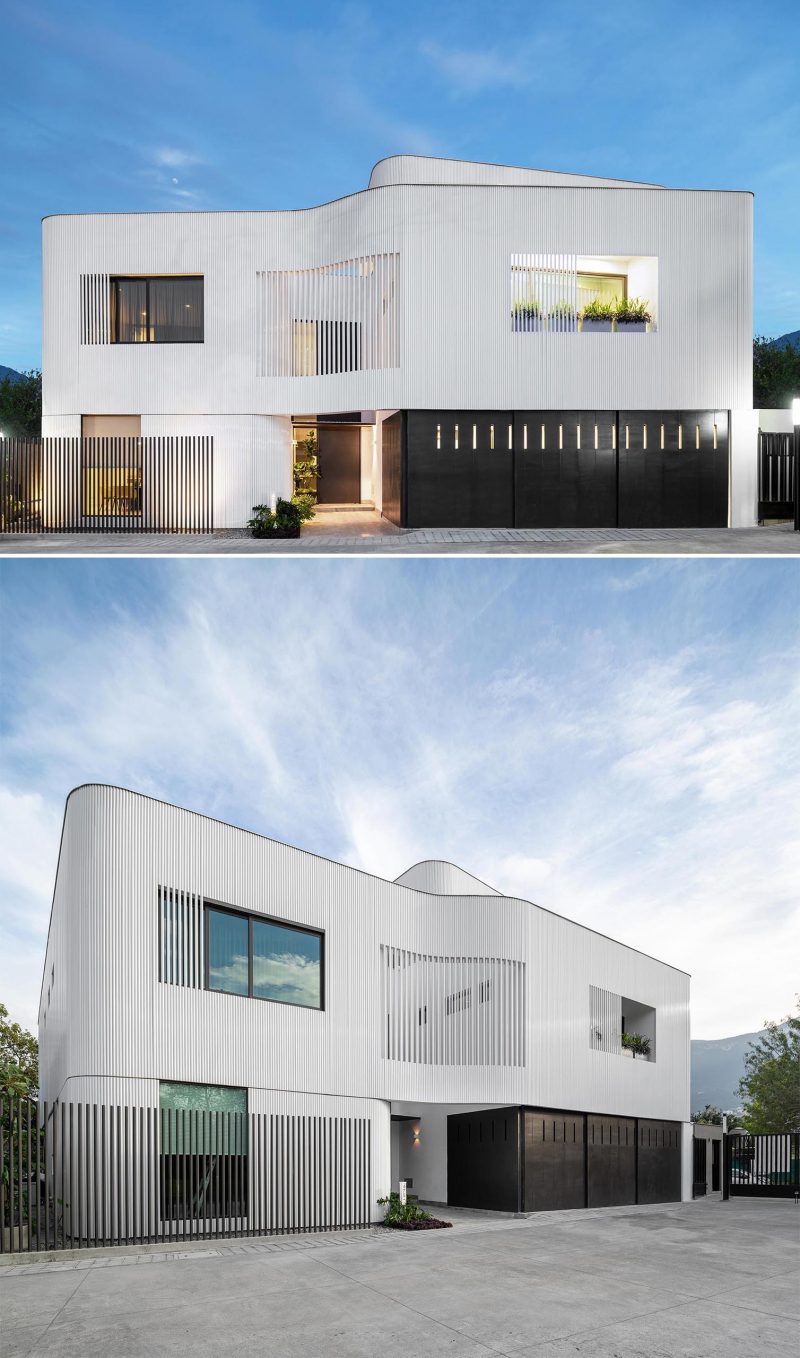 White Metal Pipes Add Texture To The Exterior Of This Home