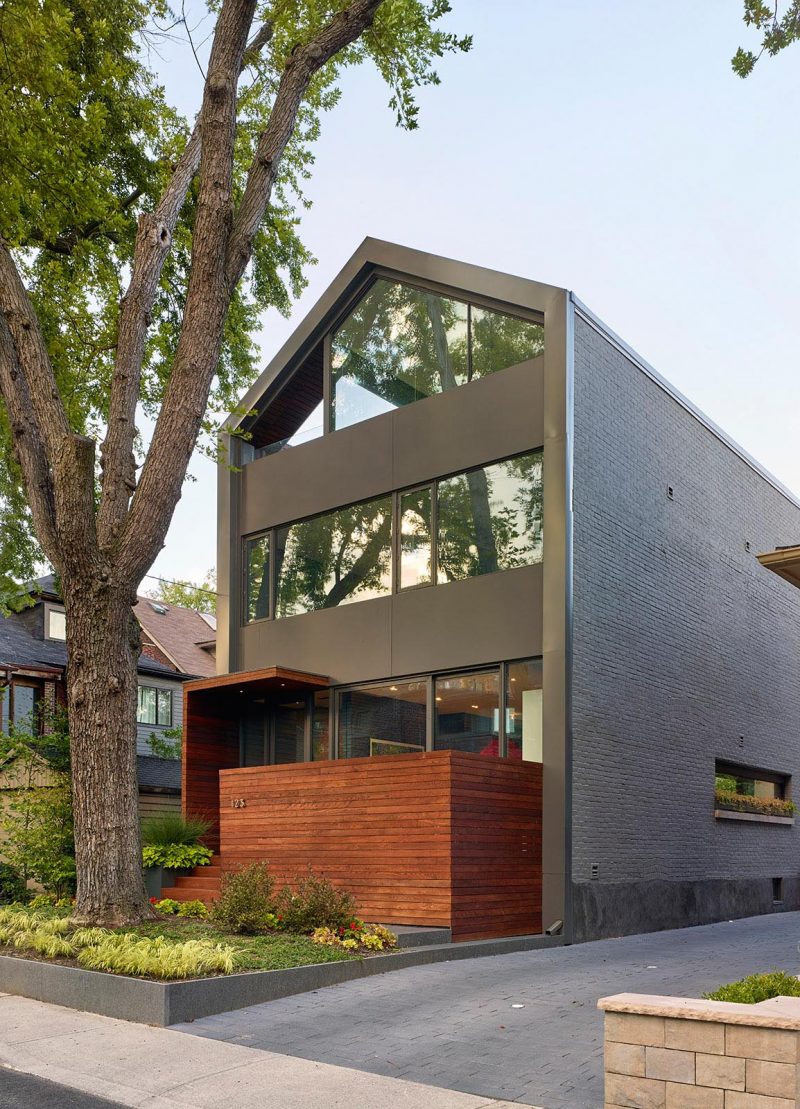 Large Windows Overlook A Garage With A Green Roof At This Home In Toronto