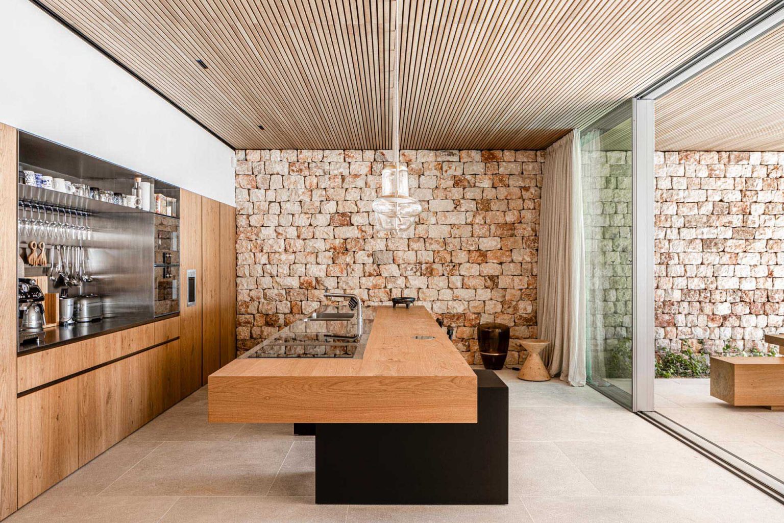 Stone Walls And Wood Shutters Are Key Design Elements Of This Home In Spain