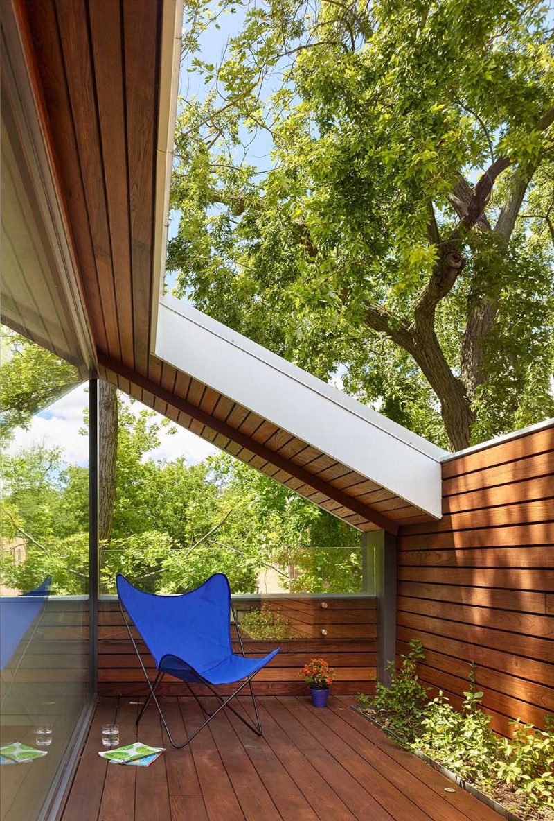 Large Windows Overlook A Garage With A Green Roof At This Home In Toronto