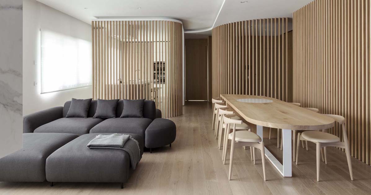 Oak Slat Walls Divide The Spaces Inside This Apartment's Interior
