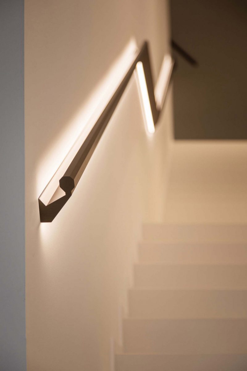 LED Lighting Above And Below The Handrail Illuminates These Stairs