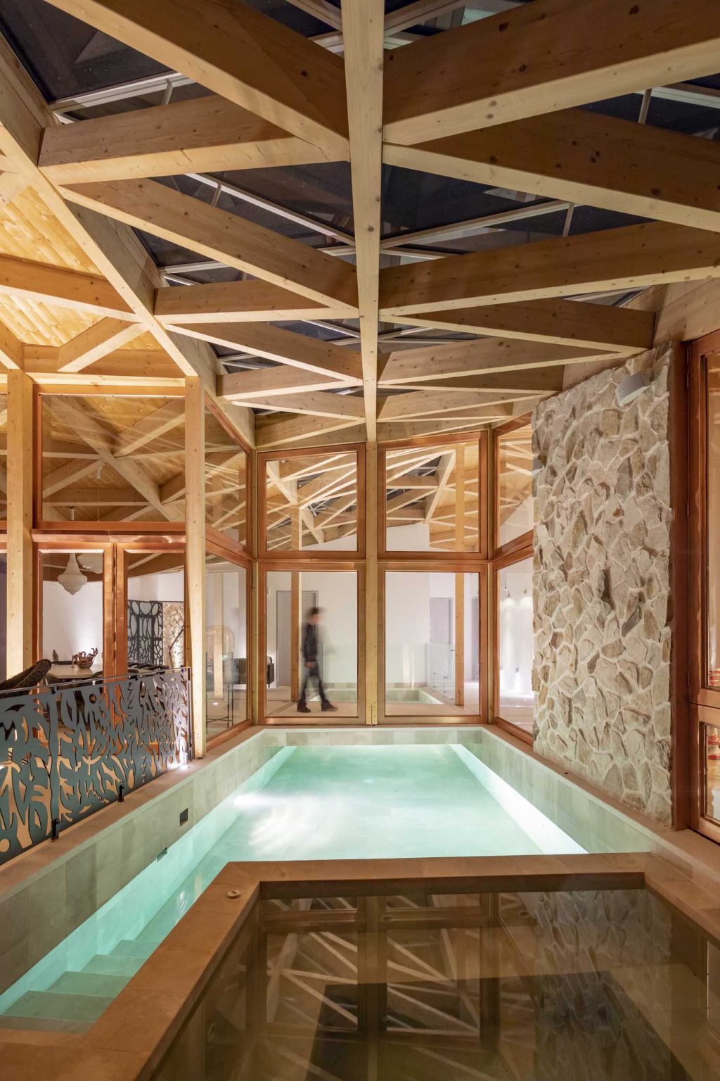 The Wavy Roof On This House Also Has An Exposed Wood Structure On The ...