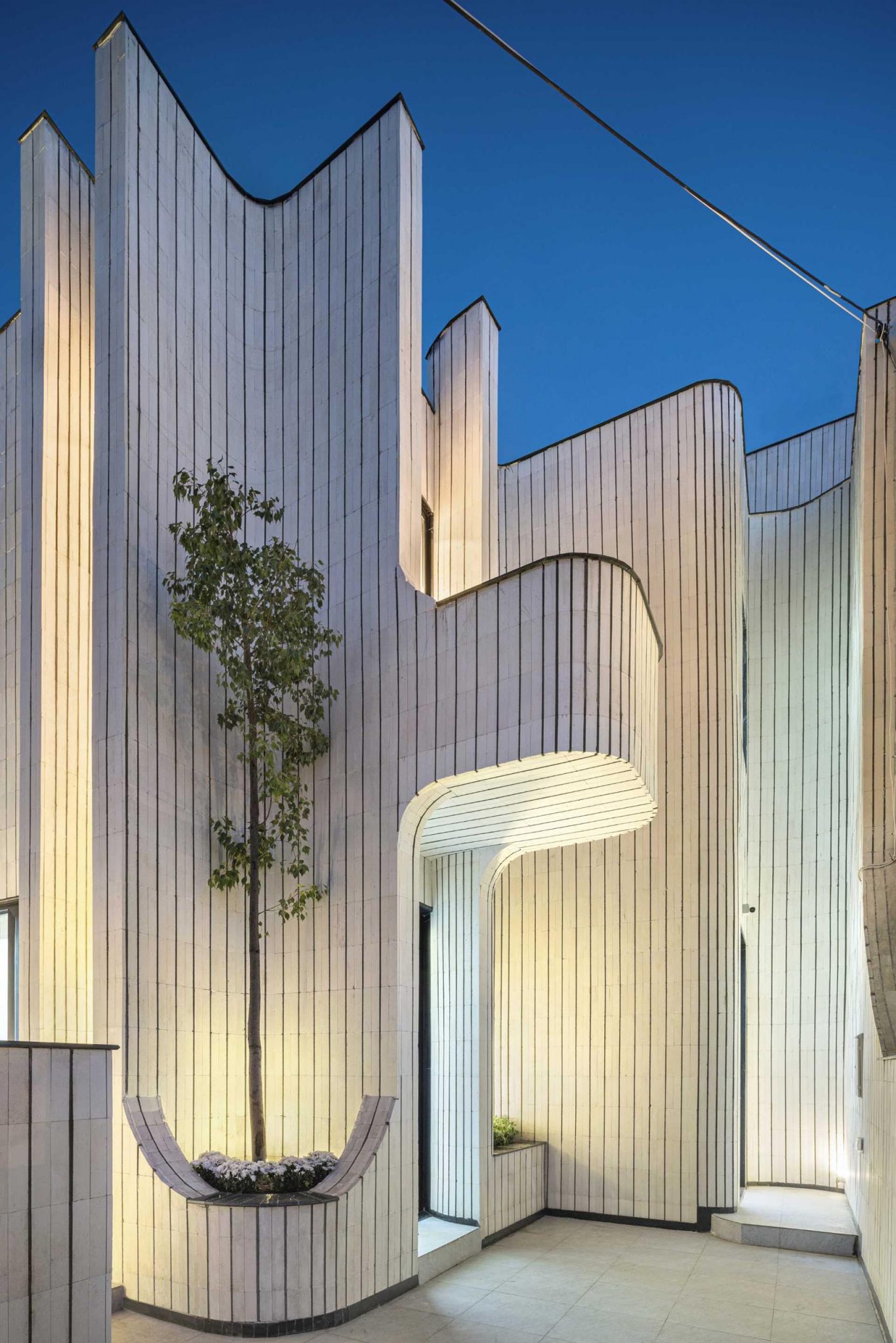 The Vertical Lines Of This Home's Exterior Siding Contribute To Its ...