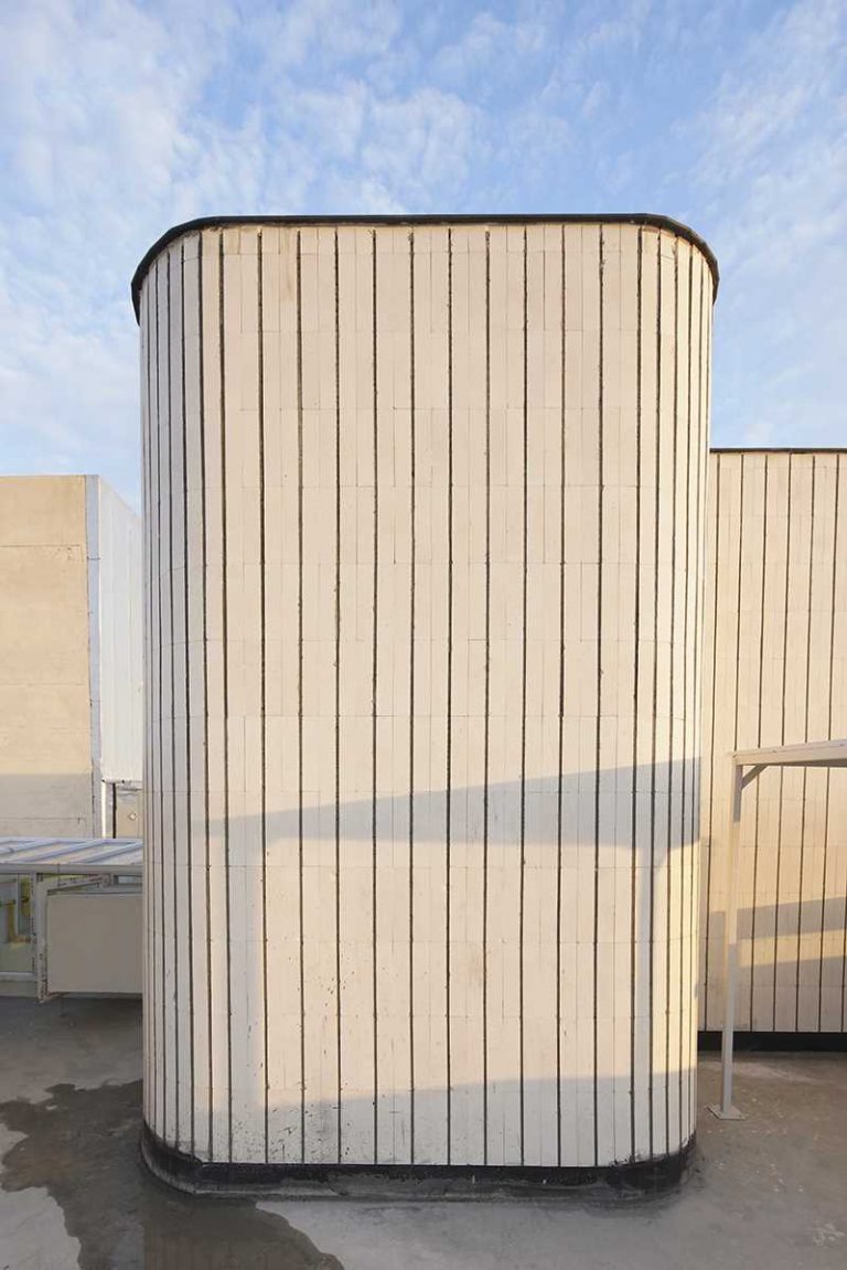 The Vertical Lines Of This Home's Exterior Siding Contribute To Its ...