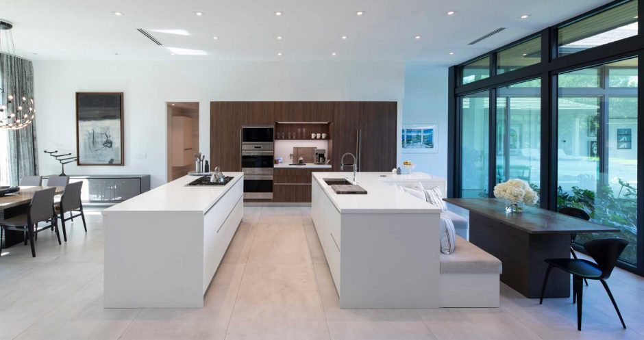 An L-Shaped Kitchen Island Is A Creative Way To Include Seating And A Table