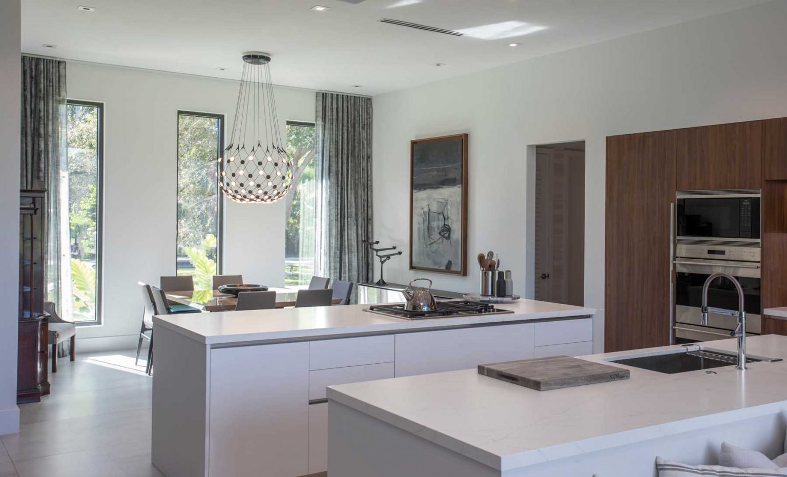 An L-Shaped Kitchen Island Is A Creative Way To Include Seating And A Table