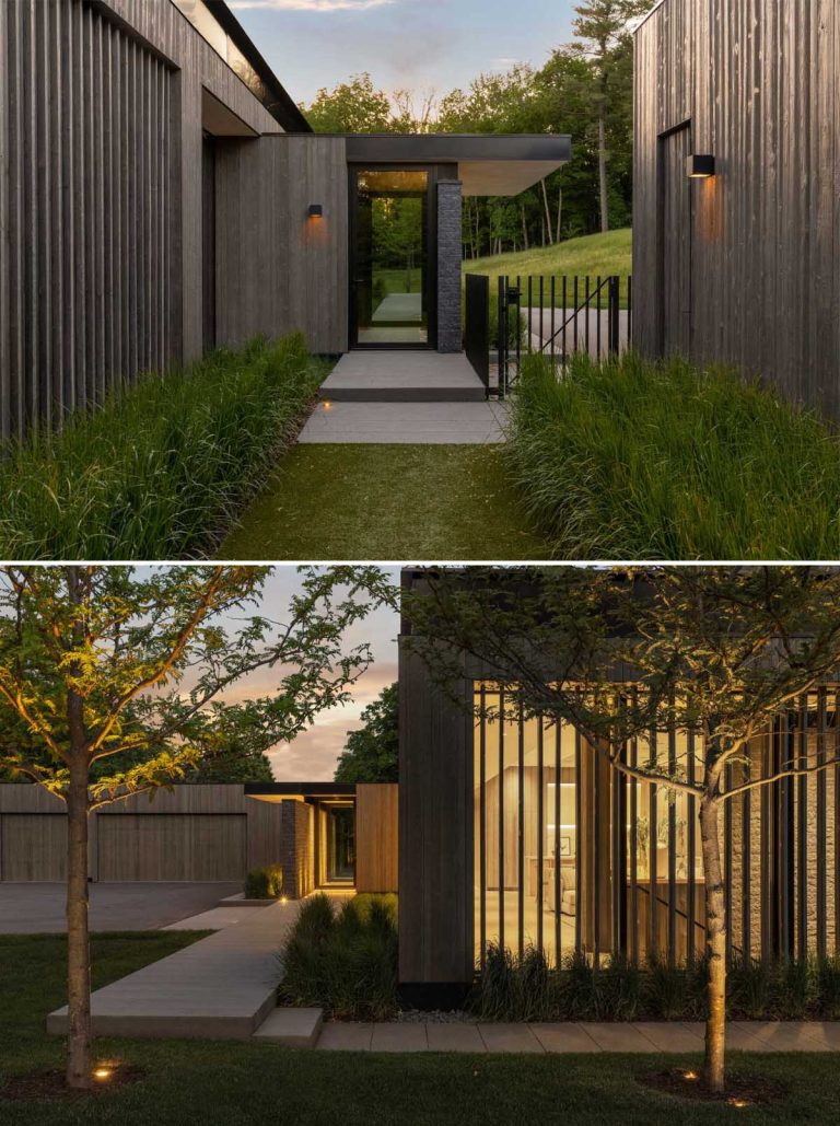 A Deep Overhanging Roof Covers The Glass Walls Of This Lake House