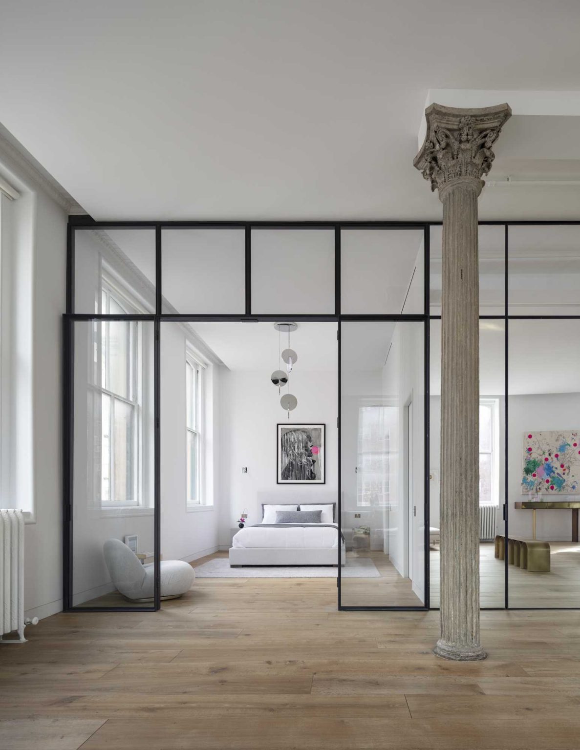 A Large Mirrored Wall Is A Prominent Feature Of This Apartment An ...