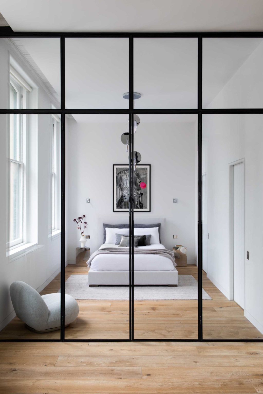 A Large Mirrored Wall Is A Prominent Feature Of This Apartment An ...