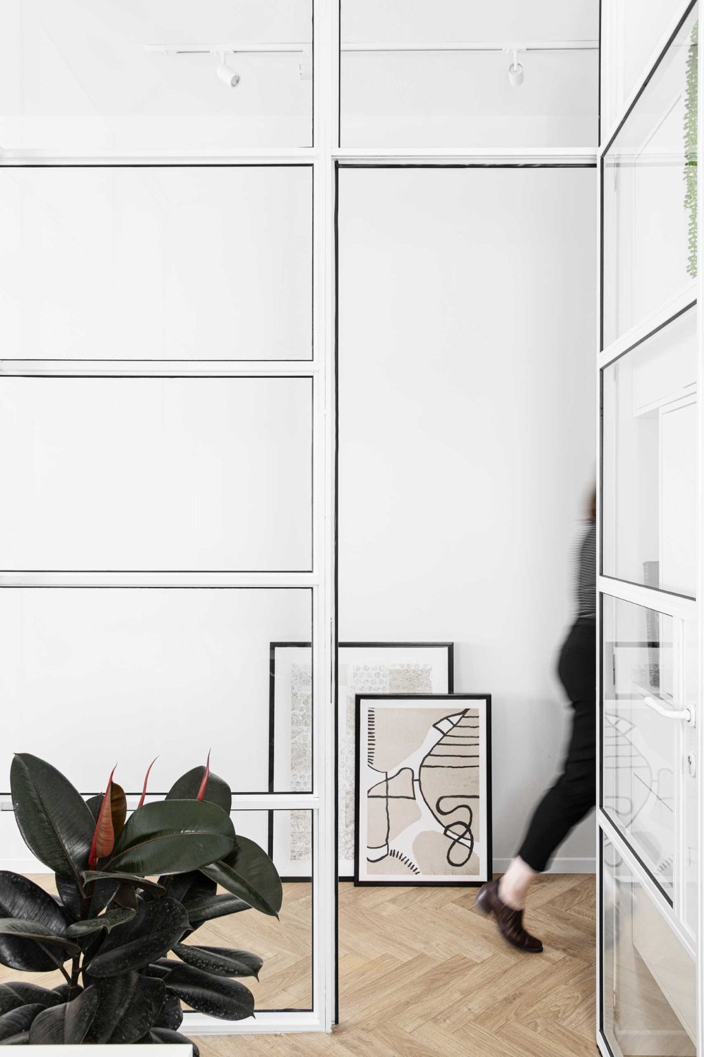 A Glass Enclosed Home Office Is Tucked In Behind The Kitchen In This ...