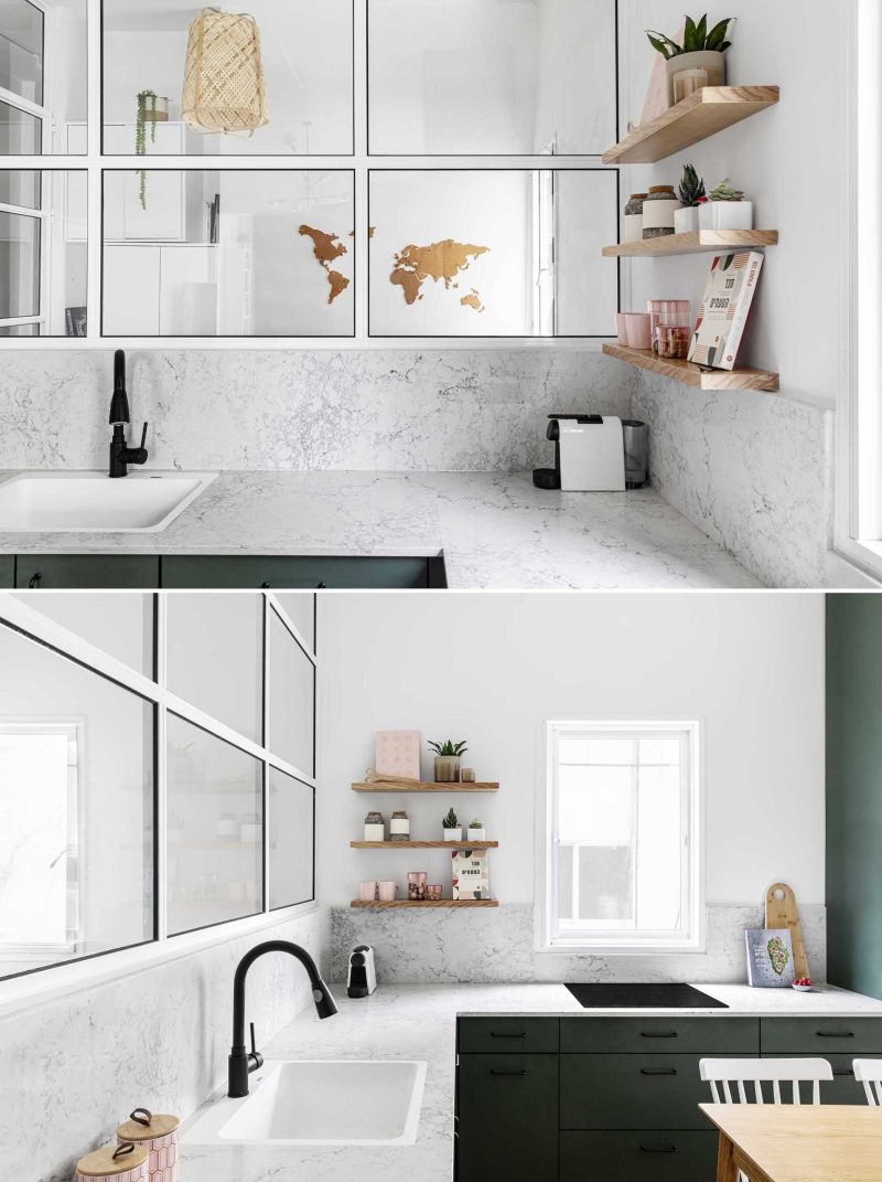 A Glass Enclosed Home Office Is Tucked In Behind The Kitchen In This ...