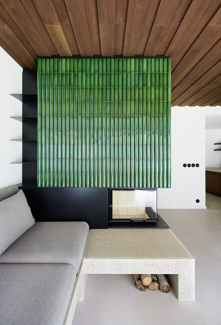 Tube-Shaped Tiles Surround The Fireplace Inside This Home