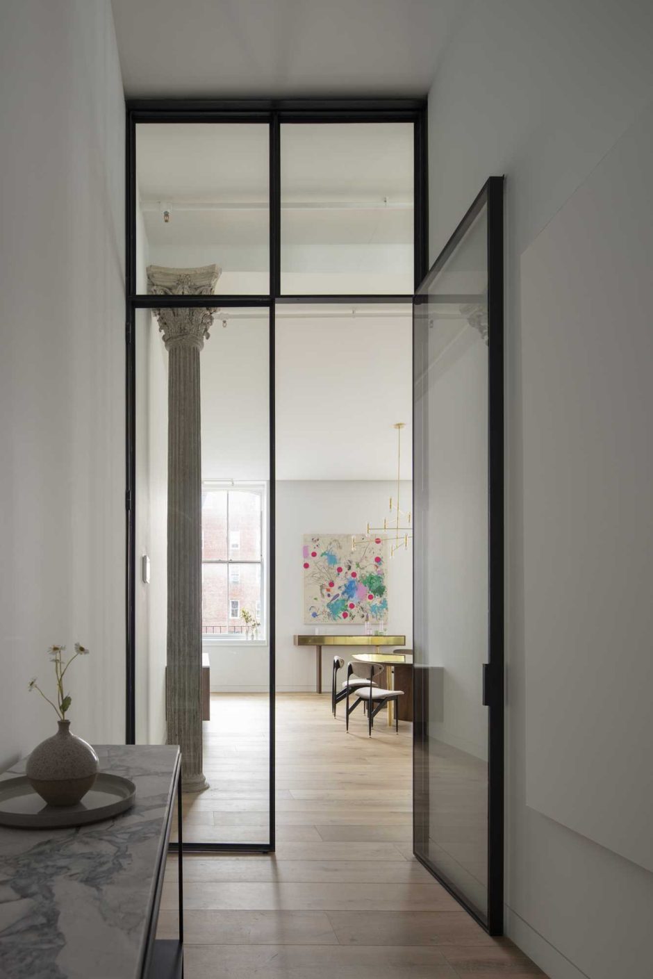 A Large Mirrored Wall Is A Prominent Feature Of This Apartment An ...