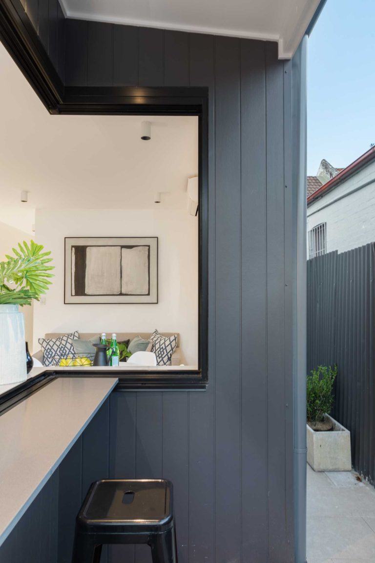 A Wall Of Bi-Fold Windows Open This Kitchen To The Outdoors