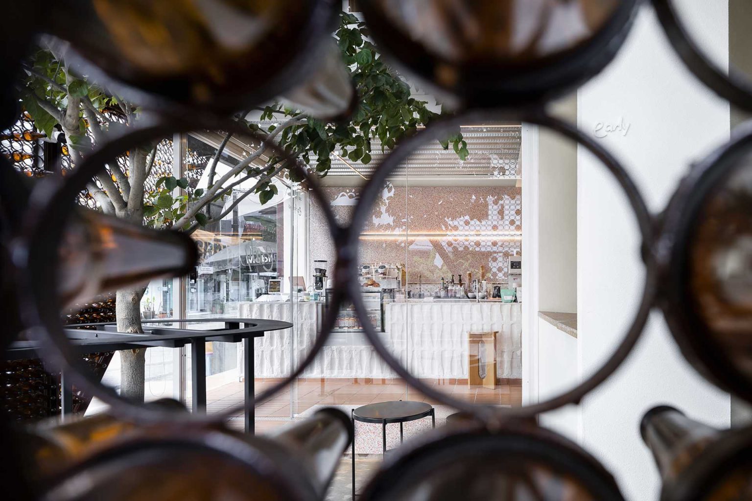The Facade Of This Cafe Holds Recycled Beer Bottles