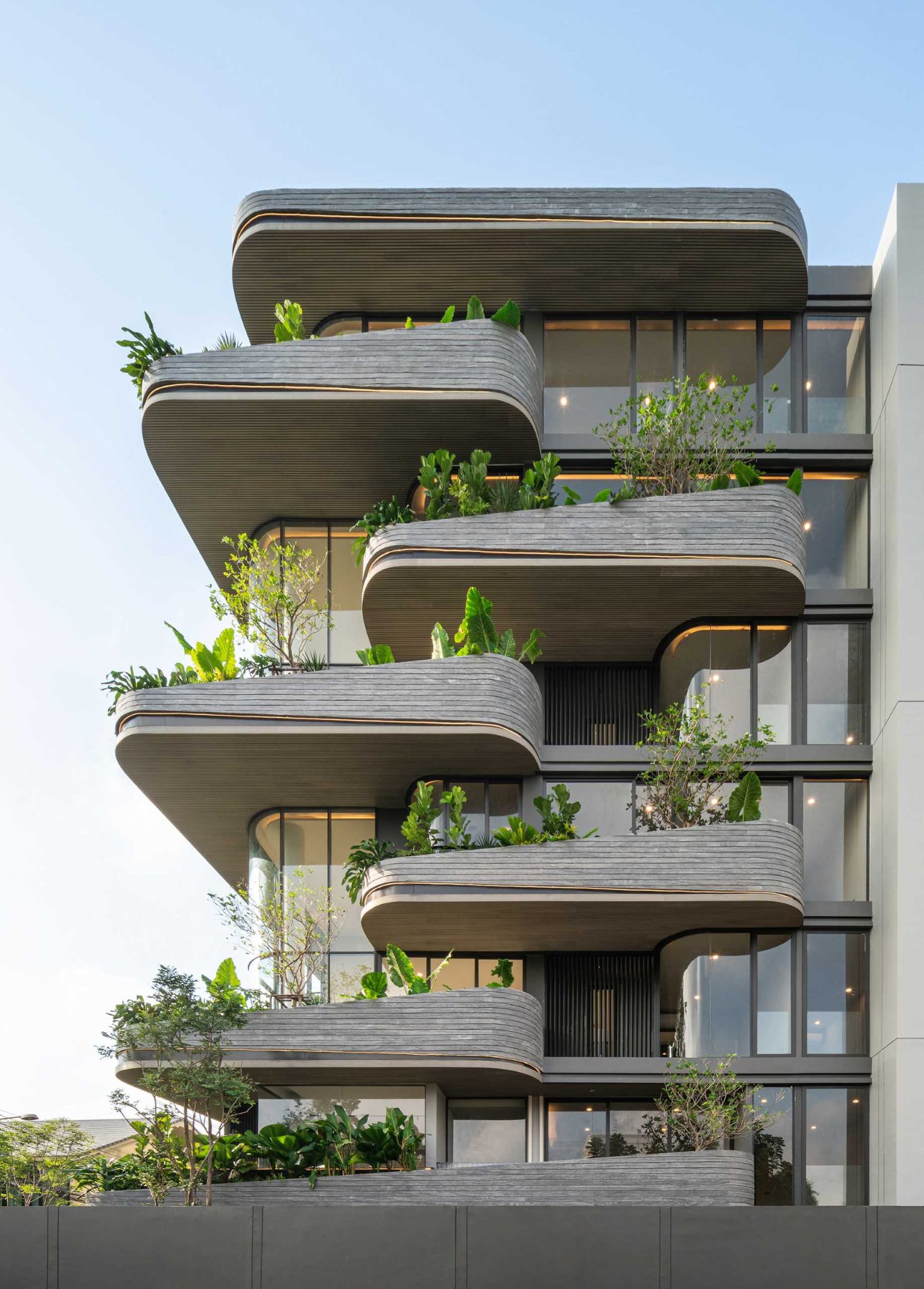 Lighting Is Used To Highlight The Rounded Balconies | International ...