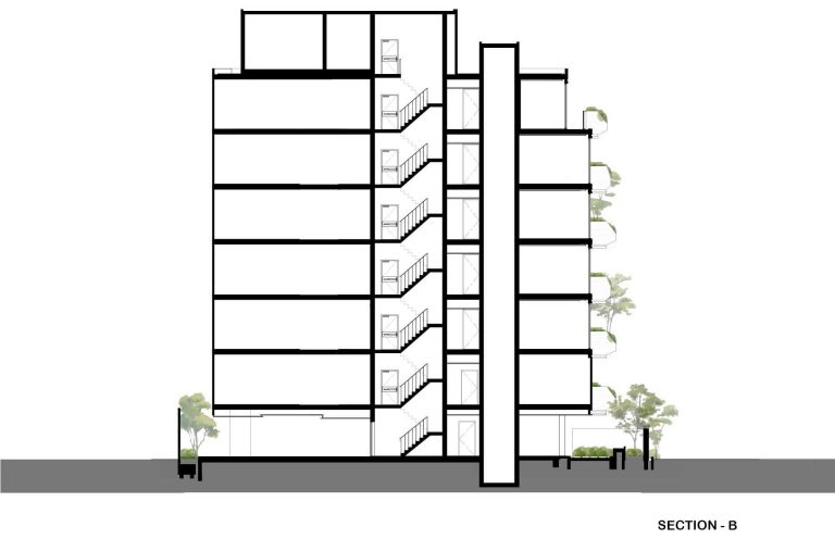 Lighting Is Used To Highlight The Rounded Balconies Of This Building