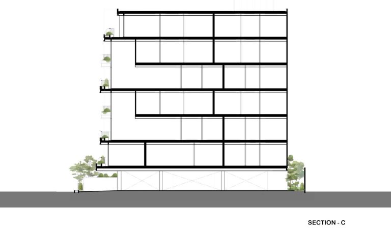 Lighting Is Used To Highlight The Rounded Balconies Of This Building