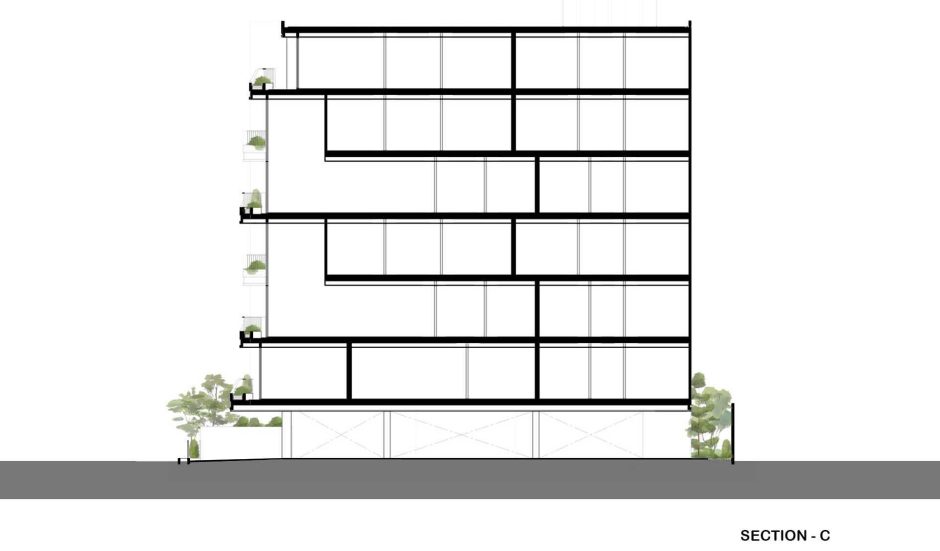 Lighting Is Used To Highlight The Rounded Balconies Of This Building