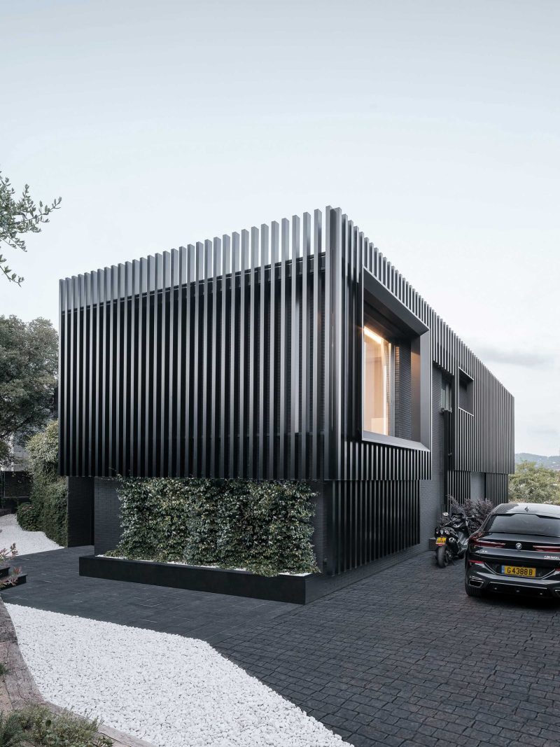Vertical Fins Surround The Exterior Of This House Giving It A Distinct ...