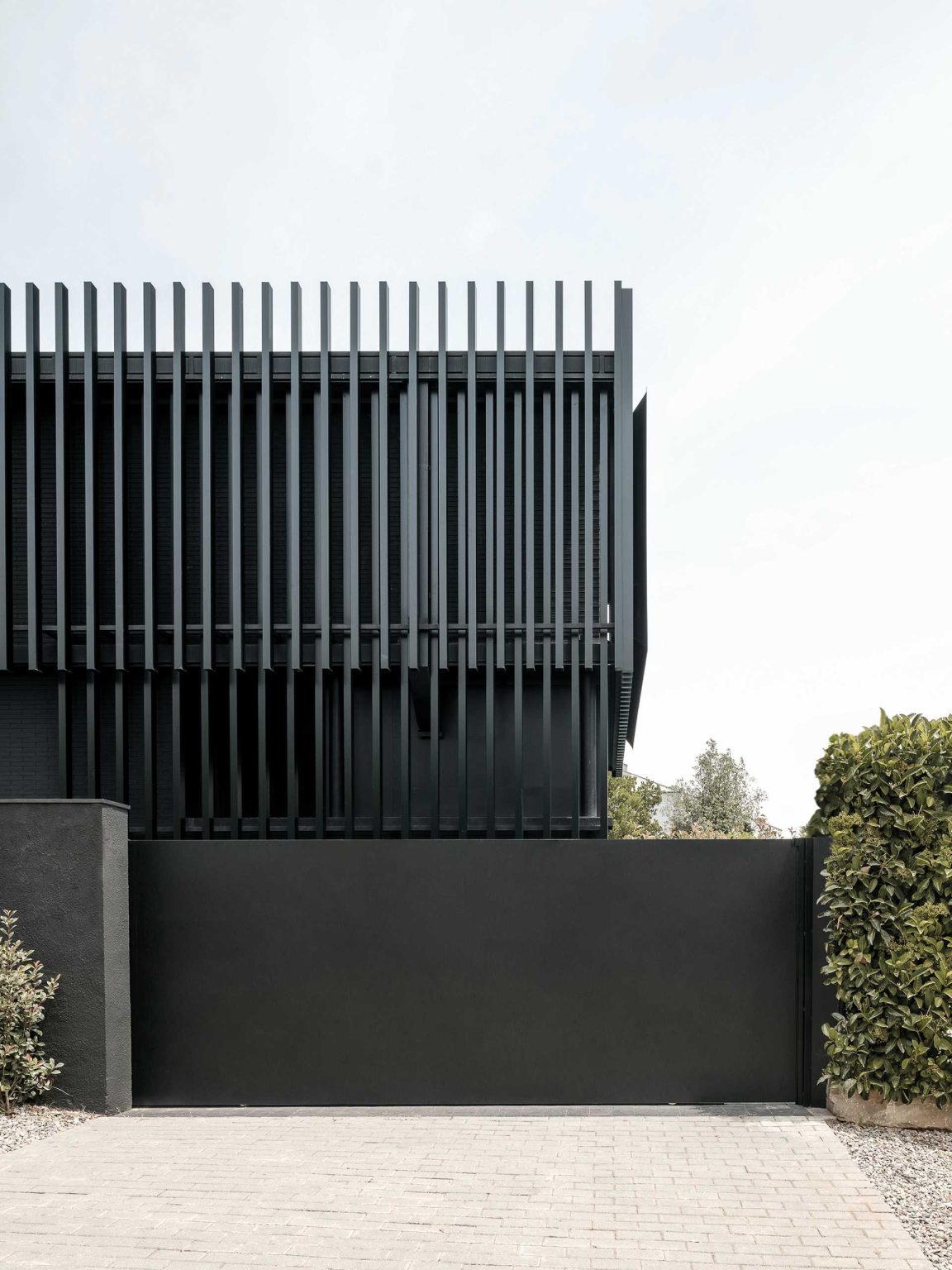 Vertical Fins Surround The Exterior Of This House Giving It A Distinct ...