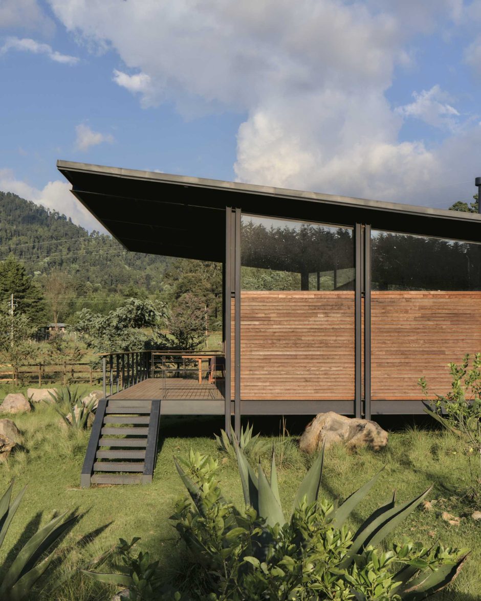 A Single Sloping Roof Covers This Home That Hovers Above The Land