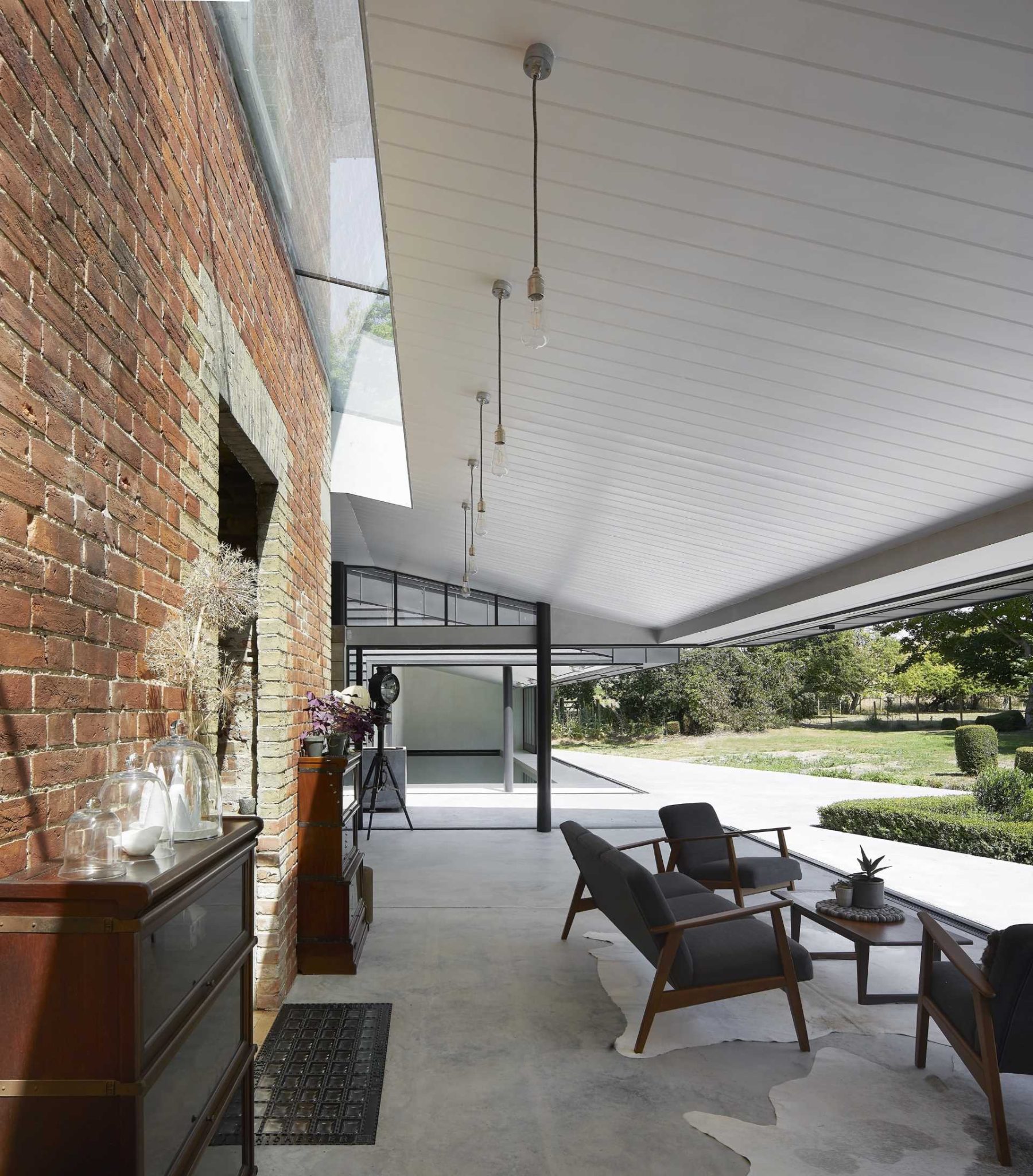 A Modern Addition For An 1830s Brick Farm House