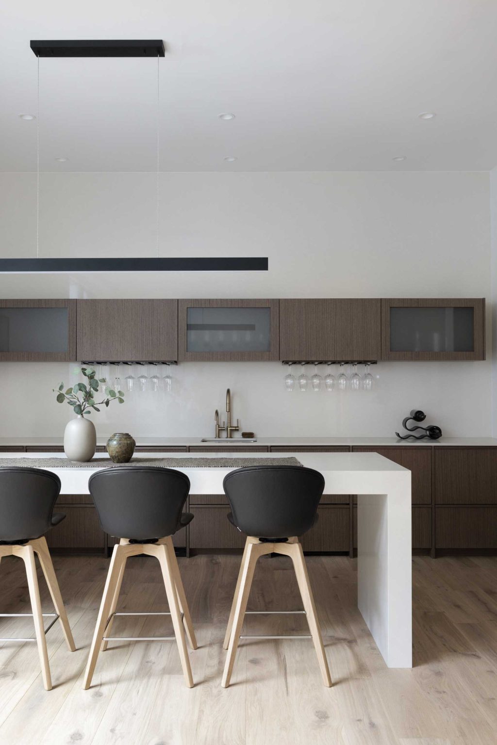 Metal Cladding Wraps Around The Large Gable Roof Of This House